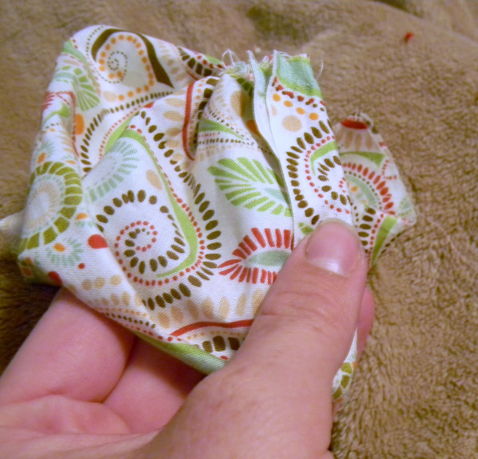 Spiral the ruffle around and rumple the other end of the ruffle down ...